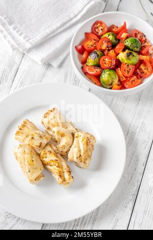 Portion of fried asian style calamari on the plate Stock Photo - Alamy