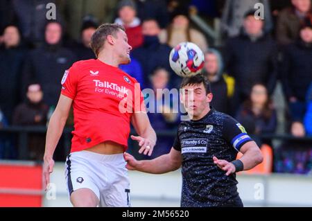Niall Canavan (6 Barrow) heads the ball challenged by Cameron McGeehan ...