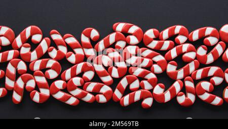 A lot of gingerbread candy cane shaped cookies, flat lay Stock Photo ...