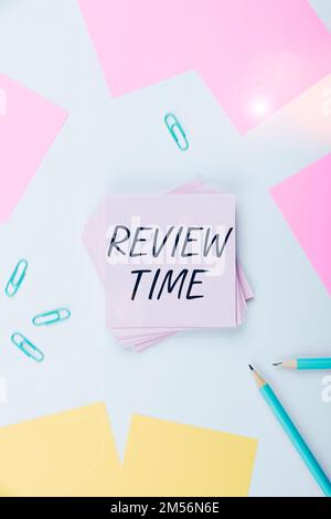 Sign displaying Review Time. Word Written on situation or system its ...