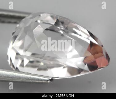 Natural beautiful stone kunzite on gray background Stock Photo - Alamy