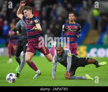 Mahlon Romeo #2 of Cardiff City fouls Jimmy Dunne #3 of QPR during the ...