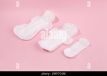 woman menstrual products compare sanitary pad size Stock Photo - Alamy