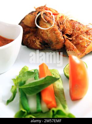big size traditional fried chicken portion with hot chili sauce with ...