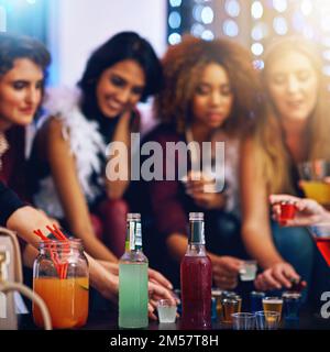 Group of friends having shots Stock Photo - Alamy