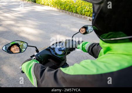 Asian woman works as a motorcycle taxi driver on the street Stock Photo ...