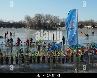 Visitors play at the ice rink in Beihai Park on the last day of the New ...