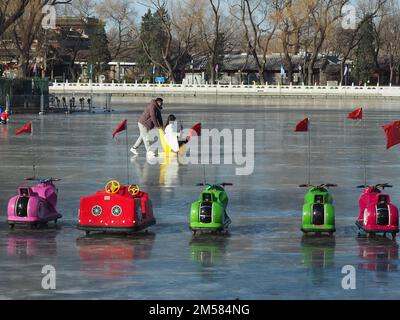 Visitors play at the ice rink in the Old Summer Palace to celebrate the ...