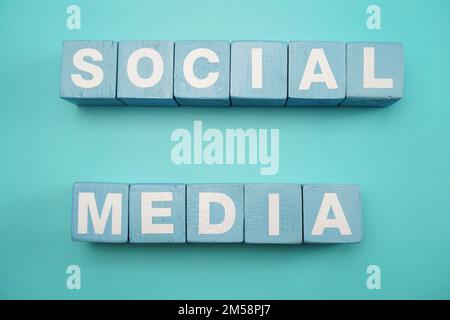 Social Media created with cubes alphabet letters on blue background ...