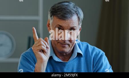 Senior displeased man shaking his finger and looking at camera isolated ...