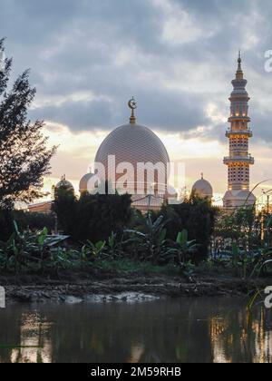 Mosque reflection on water river Stock Photo - Alamy