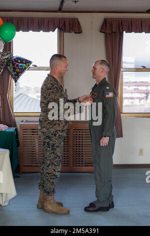 U.S. Navy Capt. Adrian Calder, left, the offgoing commanding officer of ...