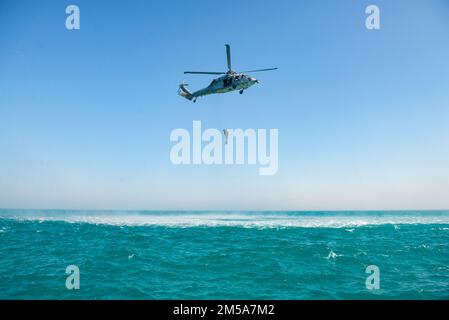 220215-N-CR519-2902 ARABIAN GULF (Feb. 15, 2022) A diver with ...