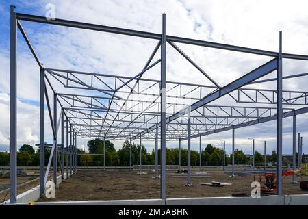 Assembled steel framework of new modern warehouse building with ...
