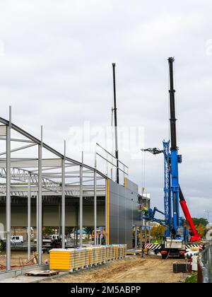 Sandwich panel facade assembly on an assembled steel frame of a new ...