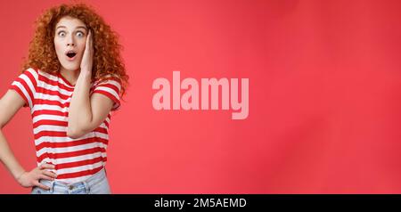 Shocked redhead girl react omg shook, drop jaw speechless, stare ...