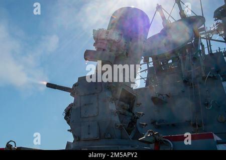 A Mark 15 Phalanx close-in weapons system fires rounds aboard guided ...