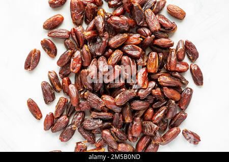 Pitted Organic Dates on gray background, top view. Flat lay, overhead ...