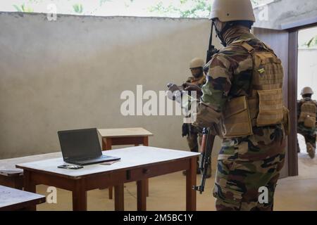 A Nigerian Armed Forces Soldier provides rear security during close ...
