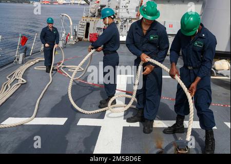 MALLACA STRAIT (Feb. 20, 2022) Sailors restow line below decks on the ...