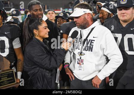 St. John Bosco Braves head coach Jason Negro lifts a trophy after the ...