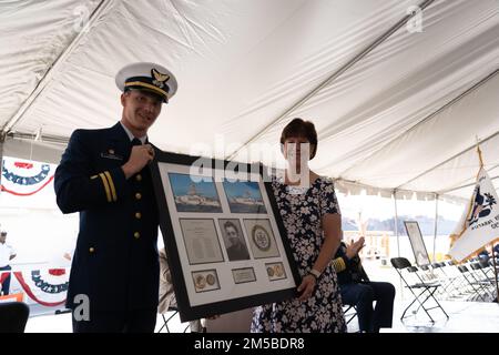 The Coast Guard Cutter John Scheuerman's crew stand at attention during ...