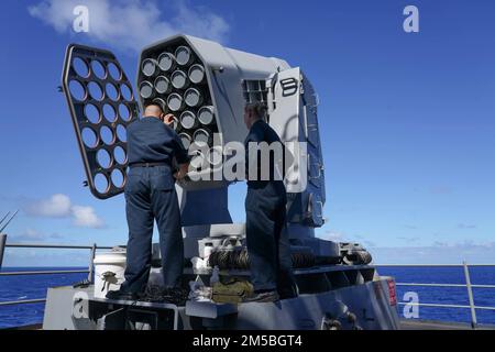 A rolling airframe missile (RAM) launcher fires a RIM-116 missile from ...