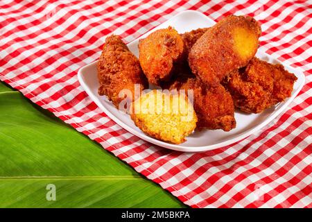 Fried tender corn croquettes - Colombian traditional food Stock Photo ...