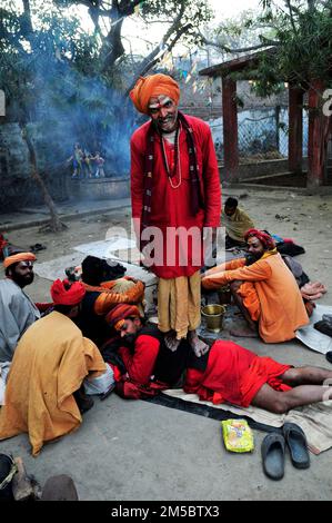 A Sadhu treating his fellow sadhu friend with Ashiatsu - walking on the ...