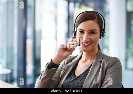 Reliable customer service is just a call away. Portrait of a friendly ...
