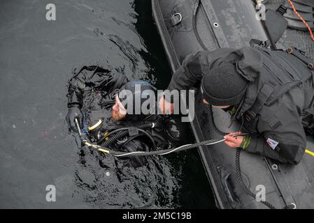 Sailor First Class Jarrett Theberge exits the hyperbaric chamber on Her ...