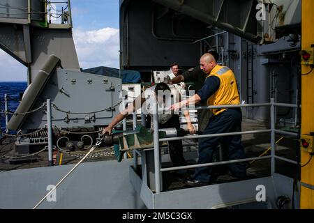 PHILIPPINE SEA (Feb. 27, 2022) Sailors bring in the ship’s torpedo ...