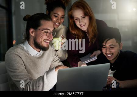 Group of creative designers working late in office Stock Photo - Alamy