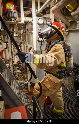 Gas Systems Technician 3rd Class Jason Bruce (left) conducts ...