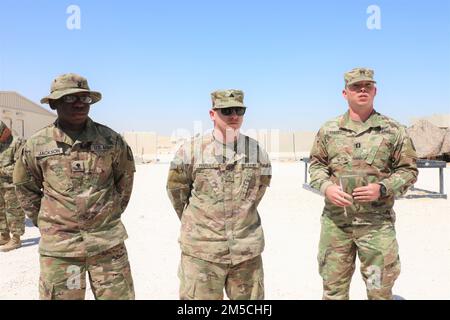 Spc. Jackson and Brig. Gen. Stewart shake hands, there is a 32nd AAMDC ...