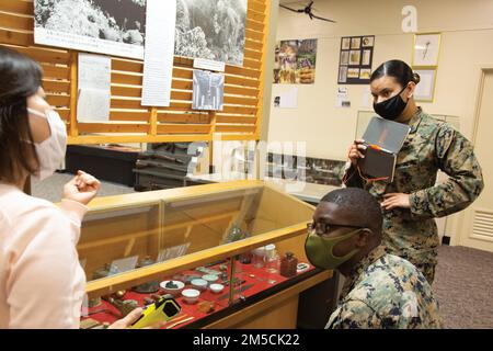 Marines from MCIPAC COMMSTRAT conduct a site survey, listening to an ...