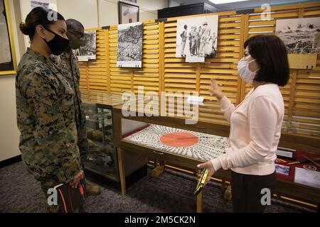 Marines from MCIPAC COMMSTRAT conduct a site survey, listening to an ...