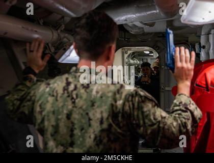 INDIAN OCEAN (March 9, 2022) Sailors participate in a swim call onboard ...