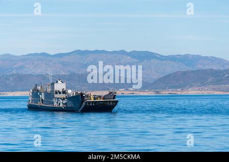 A landing craft utility (LCU) approaches the well deck of the ...