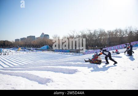 Visitors play in the Ice and Snow World of Beiling Park in Shenyang ...