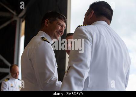 U.S. Navy Capt. Brannon Bickel, center, commodore, Helicopter Maritime ...
