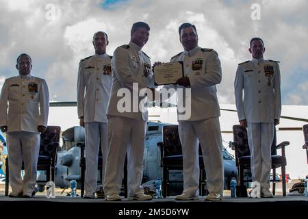 U.S. Navy Capt. Brannon Bickel, center, commodore, Helicopter Maritime ...