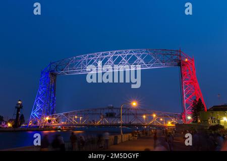 The Duluth Aerial Lift Bridge lit up in red, white, and blue colors ...