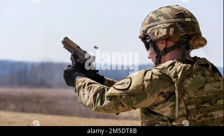 Spc. Alexis Cummins, of the 384th Military Police Company competes in ...