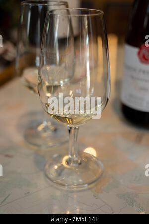 Tasting of white dry chablis chardonnay wine in small winery in Chablis ...
