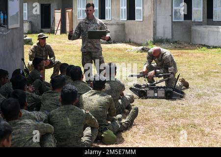 U.S. Army Staff Sgt. Derrick Manuel instructs new recruits on how to ...