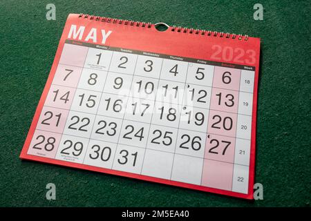 May 2023 Monthly calendar year with alarm clock on red and black ...