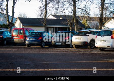 Reims, France - December 27, 2022 Various cars parked in the downtown ...