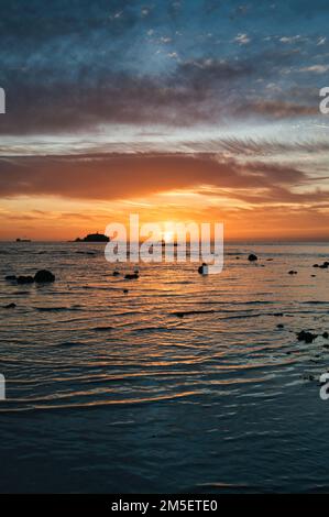 A vertical shot of the beach at sunrise. Isle of Wight Stock Photo - Alamy
