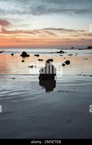 A vertical shot of the beach at sunrise. Isle of Wight Stock Photo - Alamy